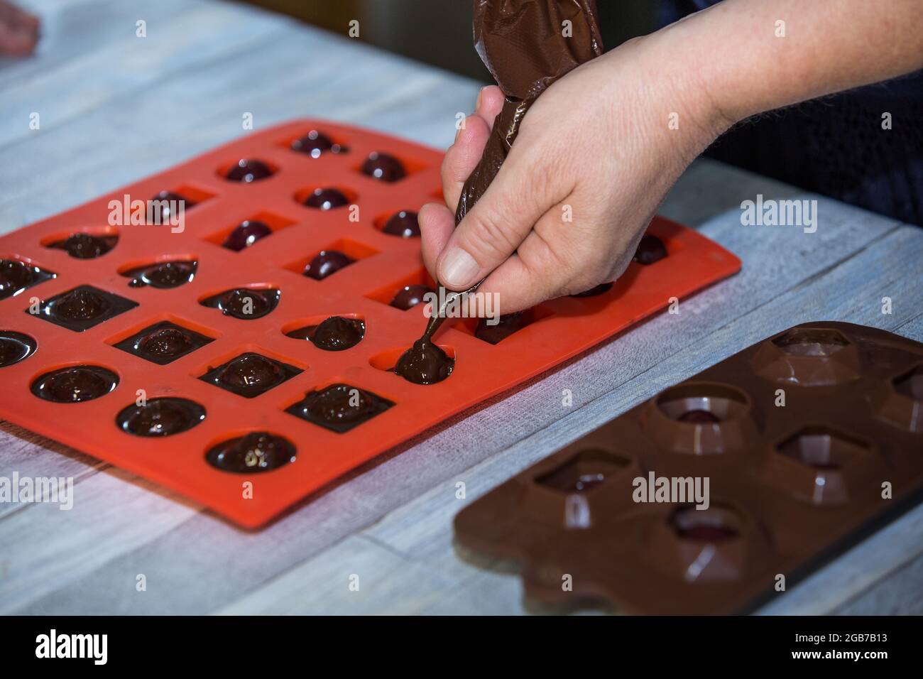 Step-by-step process of making chocolates from dark chocolate and ...