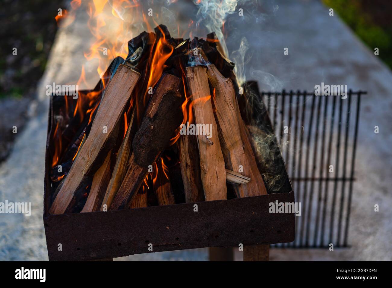 Burning wood chips to form coal. Barbecue preparation, fire before ...