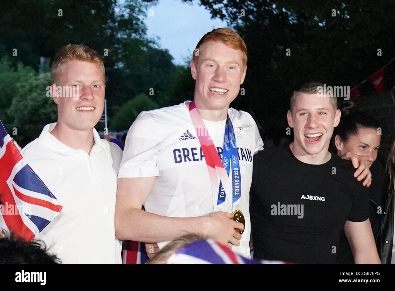 British swimmer Tom Dean (centre)at a welcome home party at his family ...