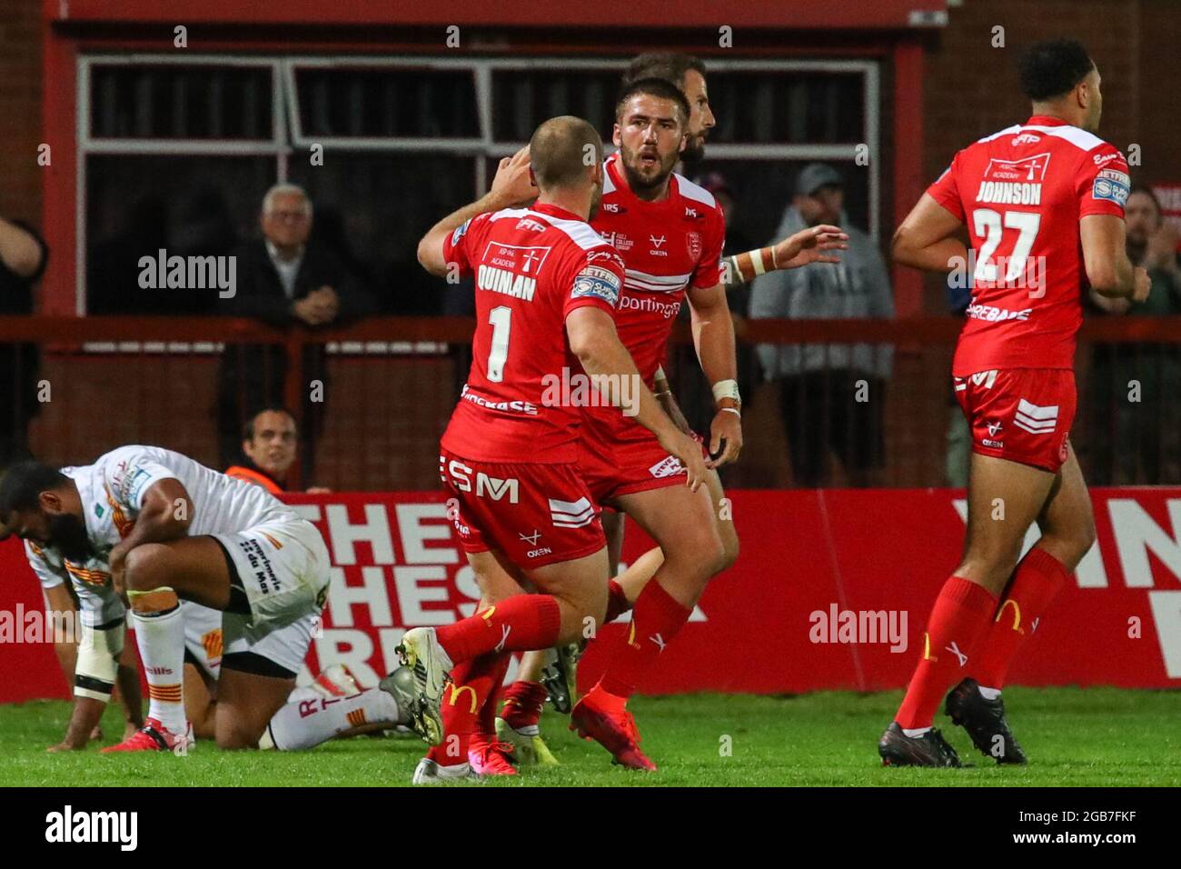 Adam Quinlan (1) of Hull KR is congratulated by Greg Minikin (3) of ...
