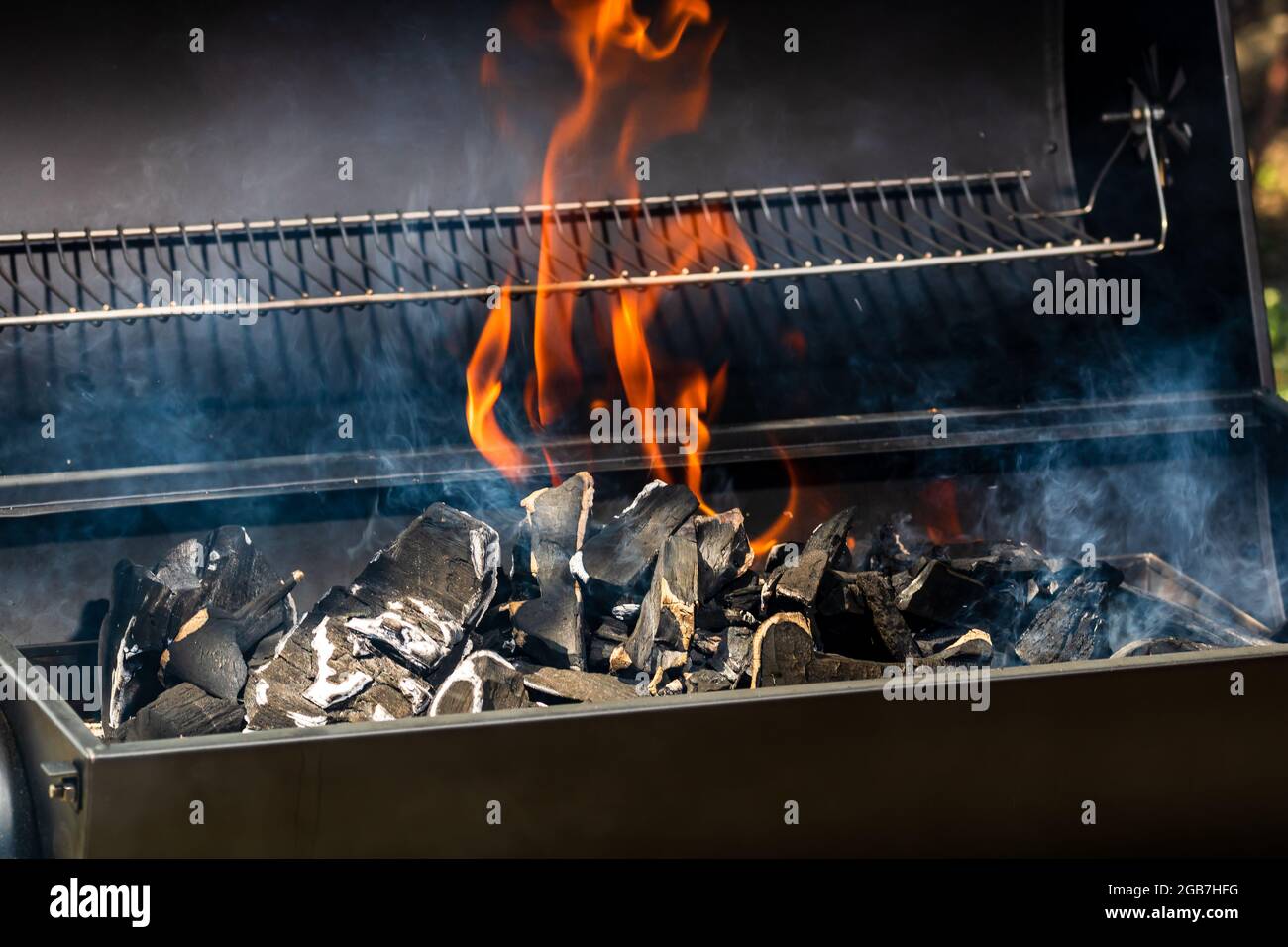 Barbecue grill pit with glowing and flaming hot open fire with red ...