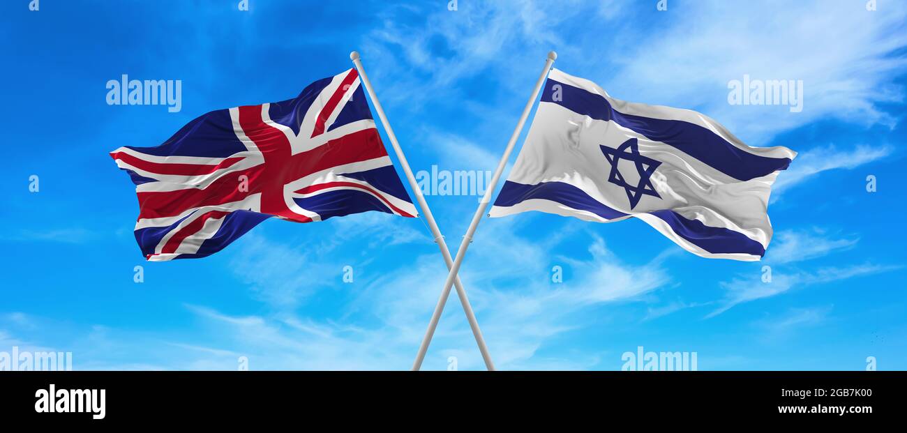 flags of great Britain and Israel waving in the wind on flagpoles ...