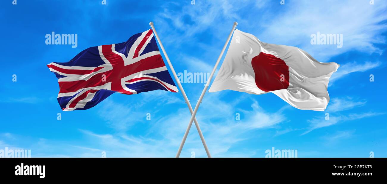 flags of great Britain and japan waving in the wind on flagpoles ...
