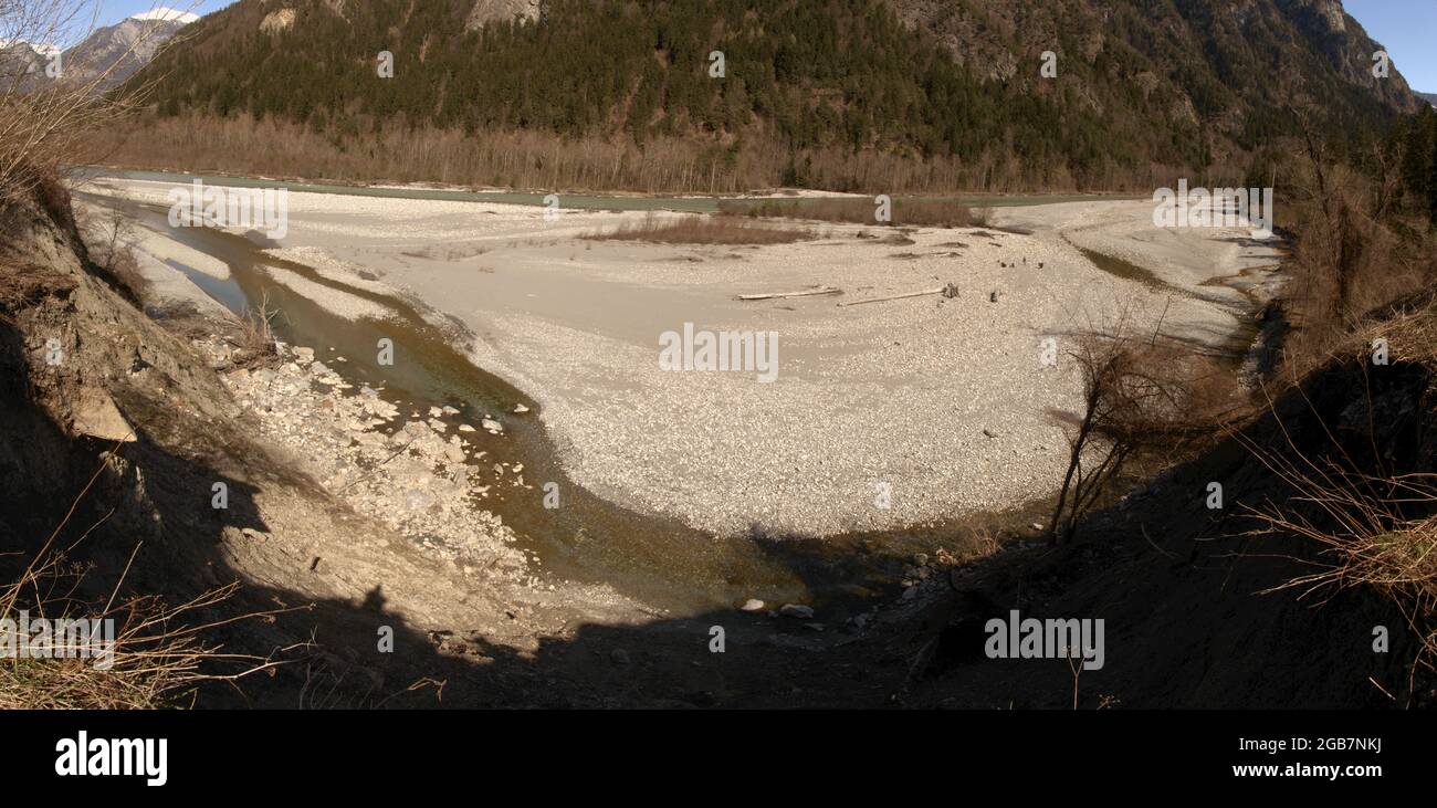 Stretch of the Grisonian Alpine Rhine river at Rhäzuns, showing shingle ...