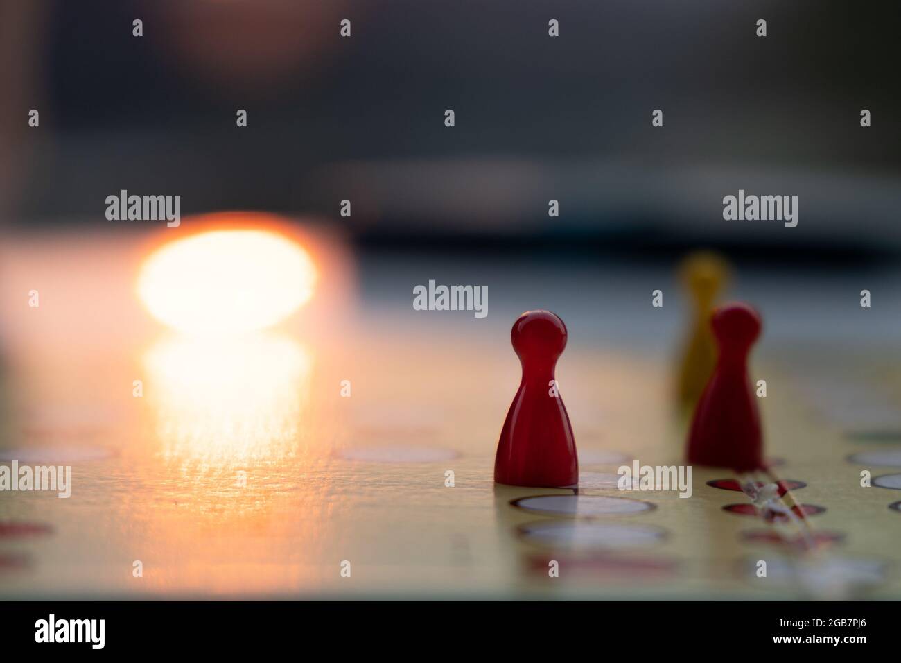 close up view of a board game with colorful game pieces - focus on one ...