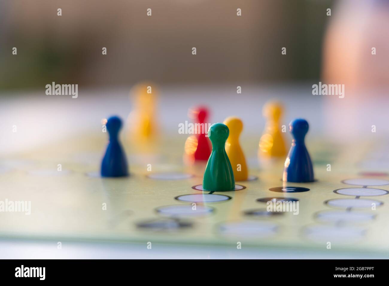 close up view of a board game with colorful game pieces - focus on one ...