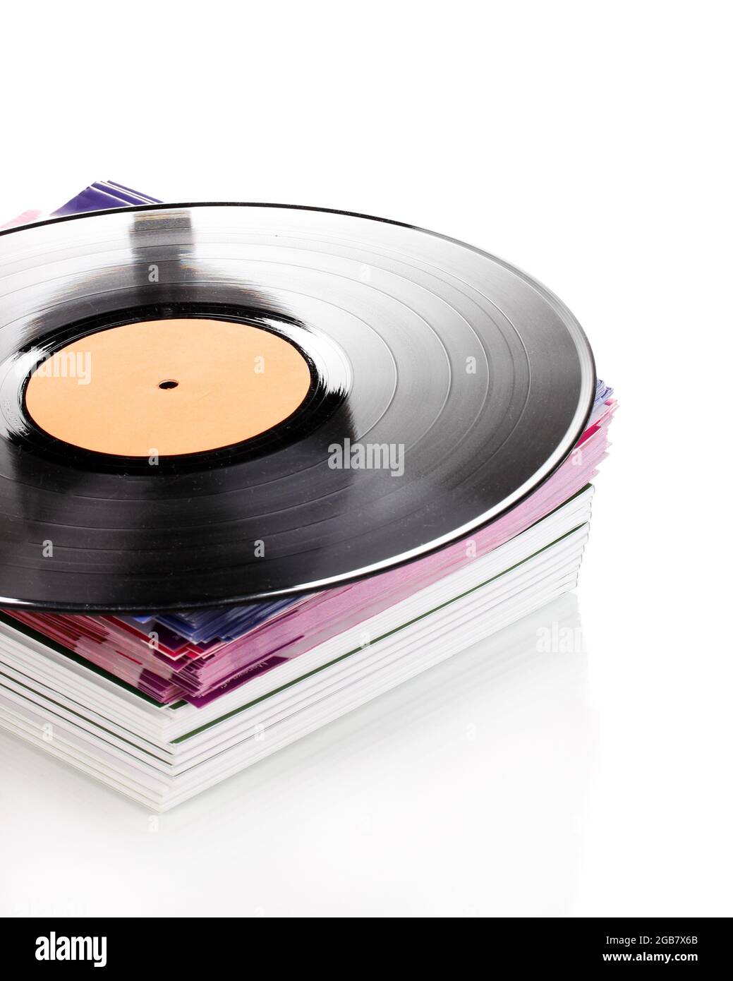 Black vinyl record and stack of magazines isolated on white Stock Photo ...