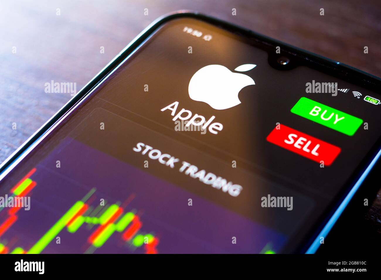 In this photo illustration the stock trading graph of Apple seen on a ...