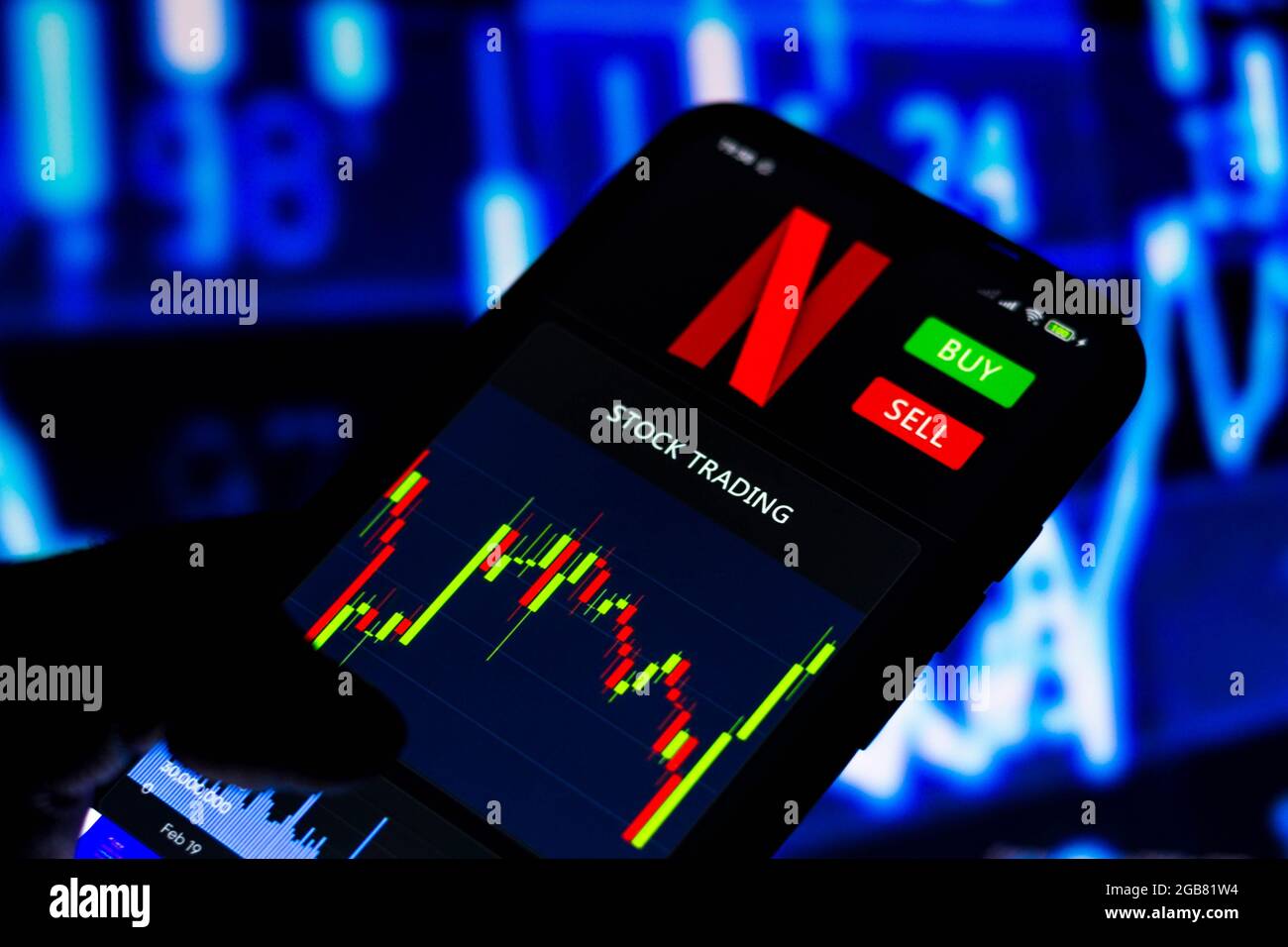 In this photo illustration the stock trading graph of Netflix seen on a ...
