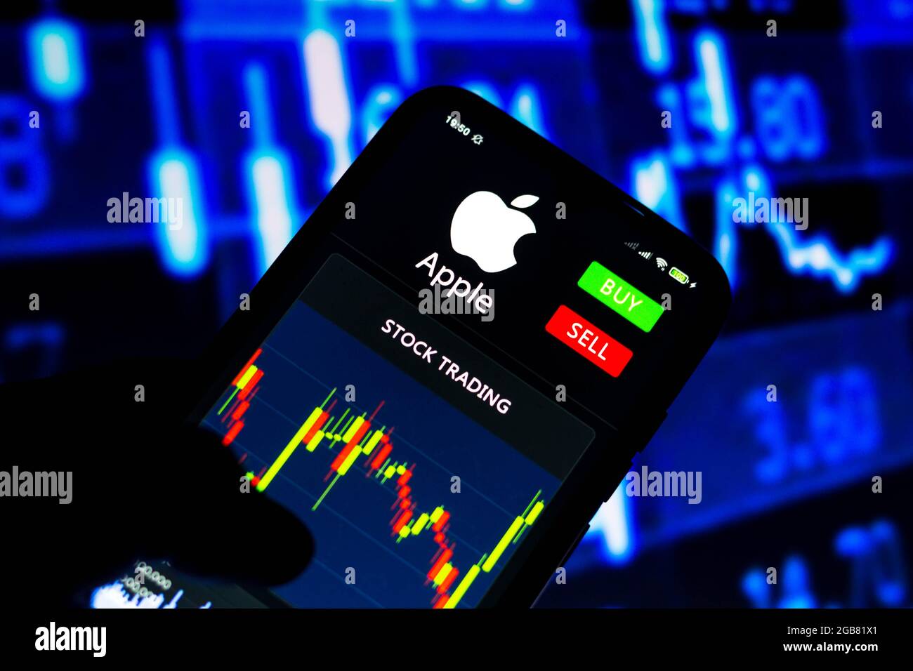 In this photo illustration the stock trading graph of Apple seen on a ...