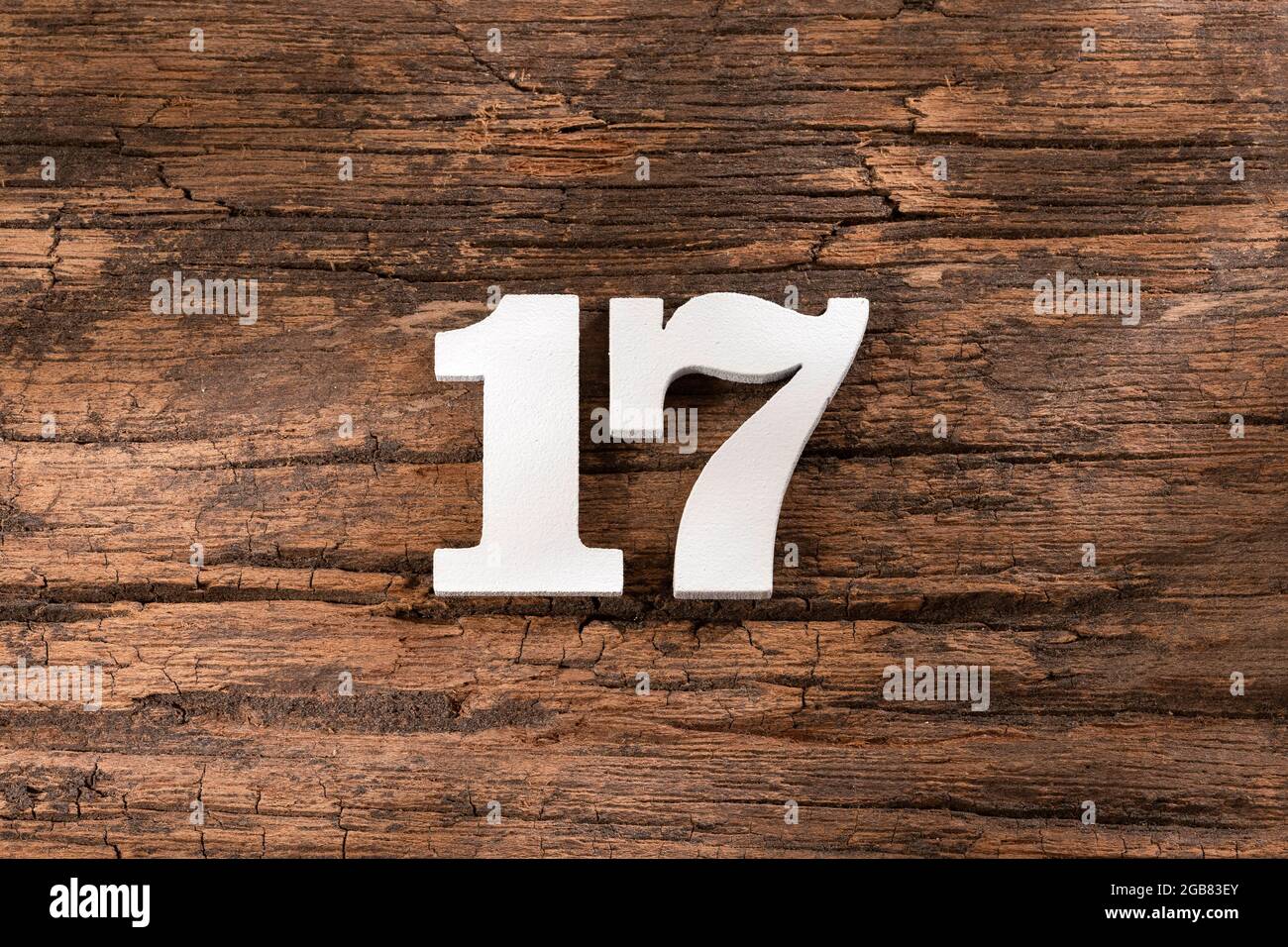 seventeen 17 - White wooden number on rustic background Stock Photo - Alamy