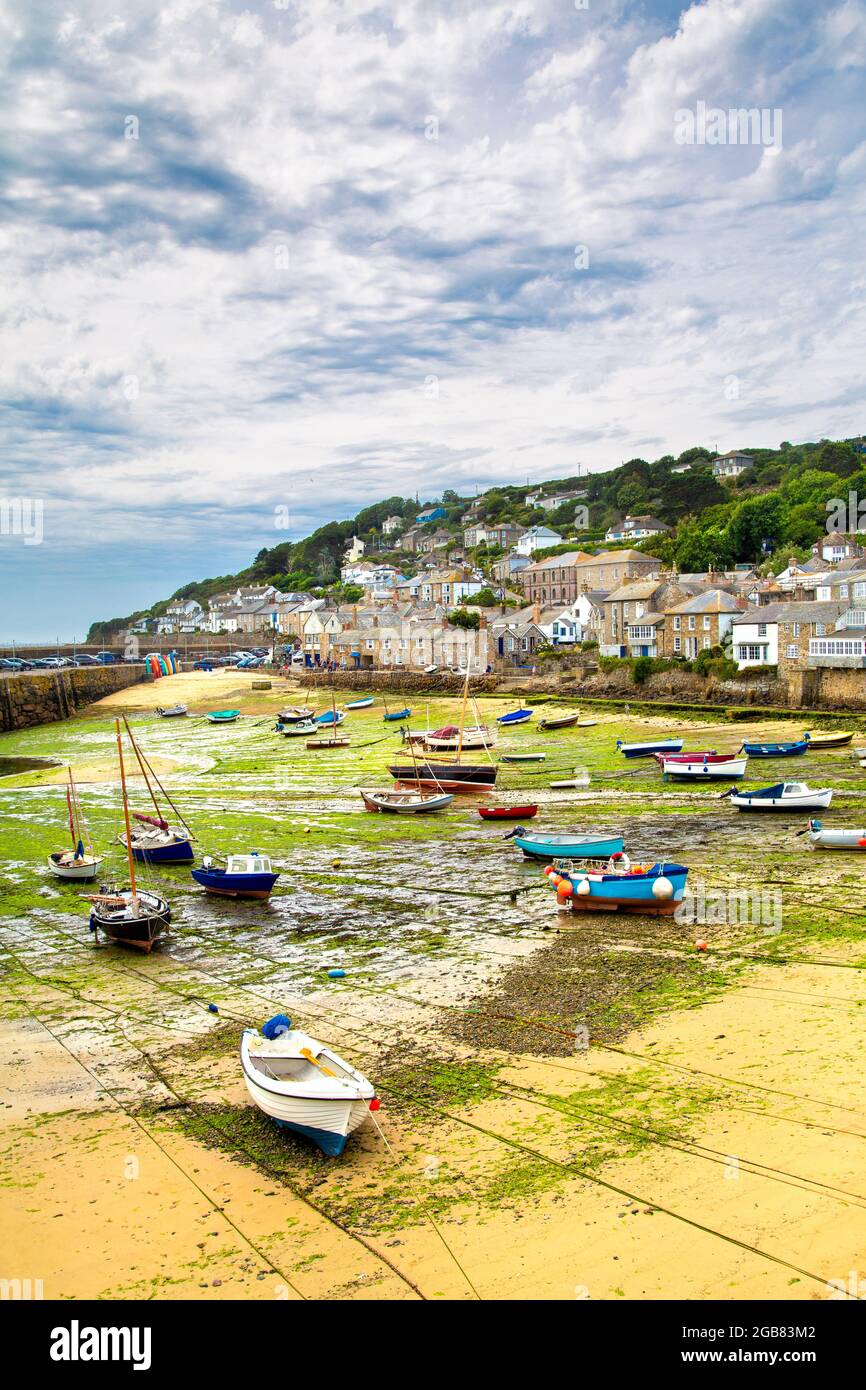 Boats stranded at low tide at Mousehole Harbour, Mousehole, Penwith ...
