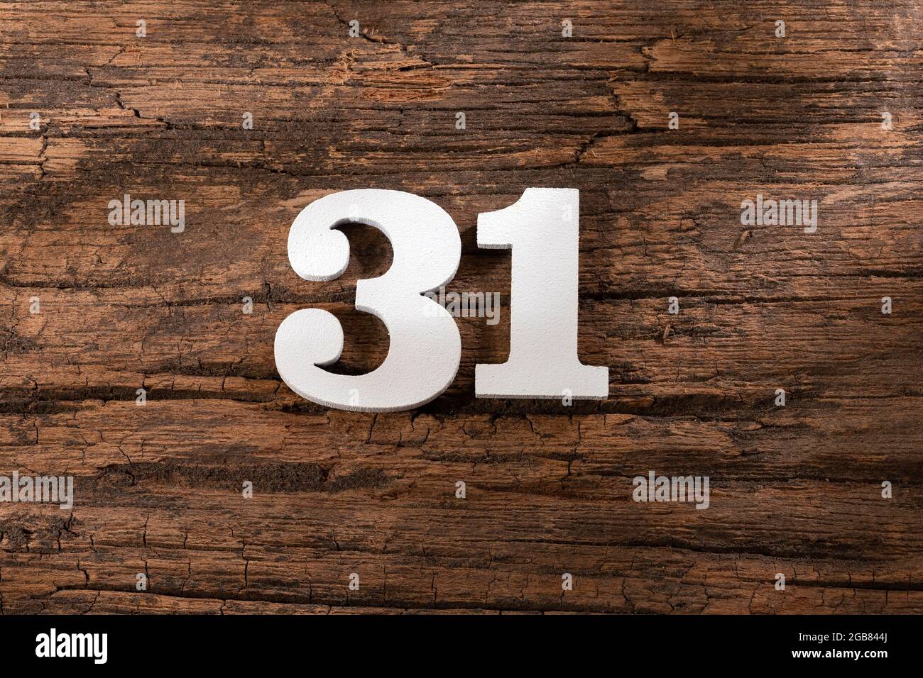 thirty one 31 - White wooden number on rustic background Stock Photo ...