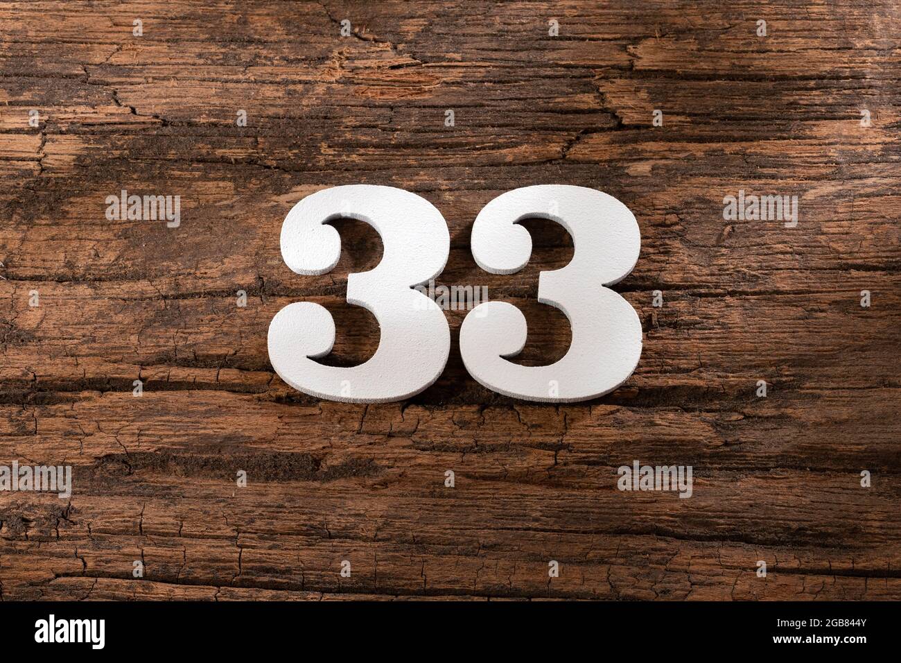 thirty three 33 - White wooden number on rustic background Stock Photo ...