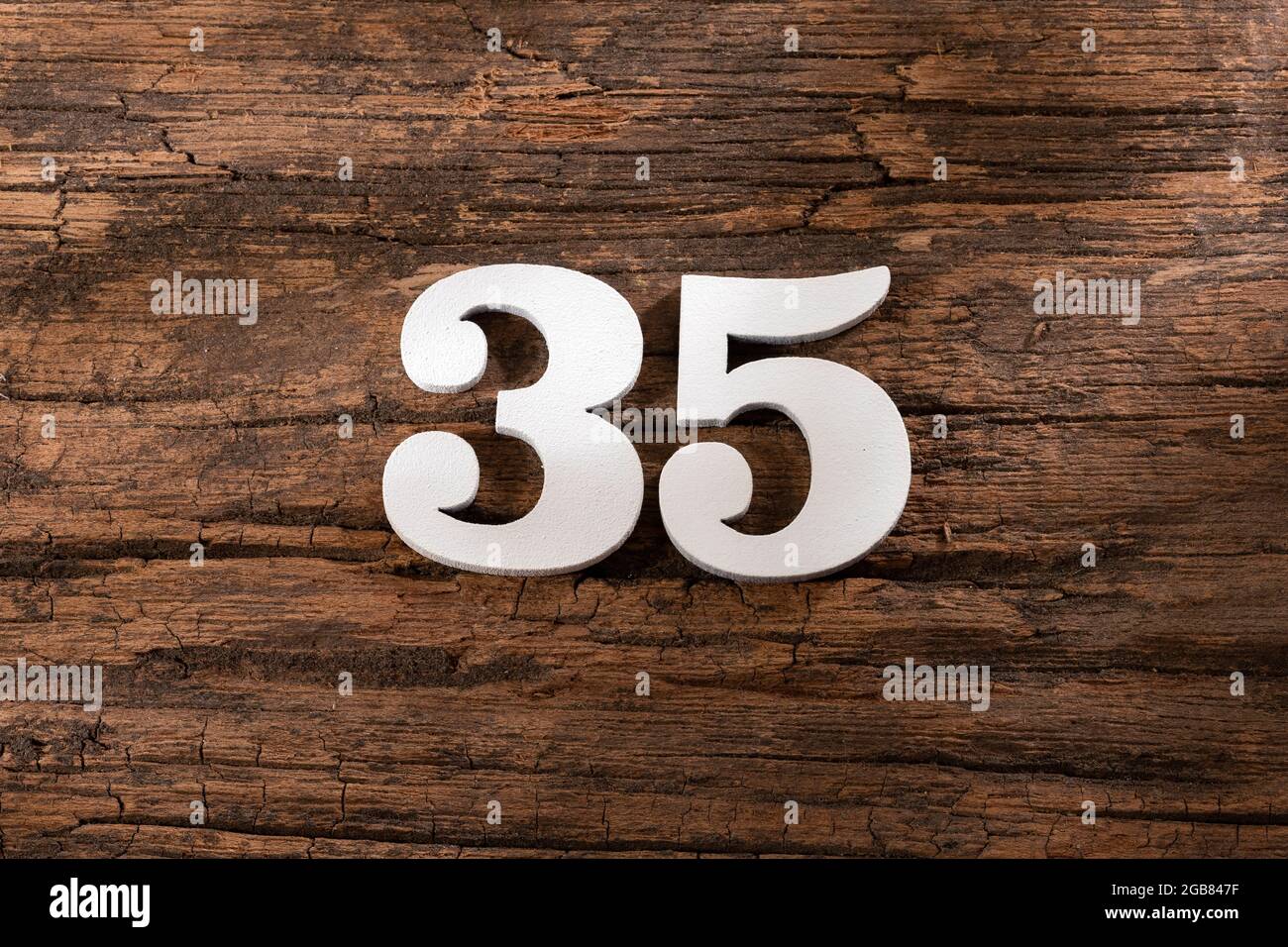thirty five 35 - White wooden number on rustic background Stock Photo ...
