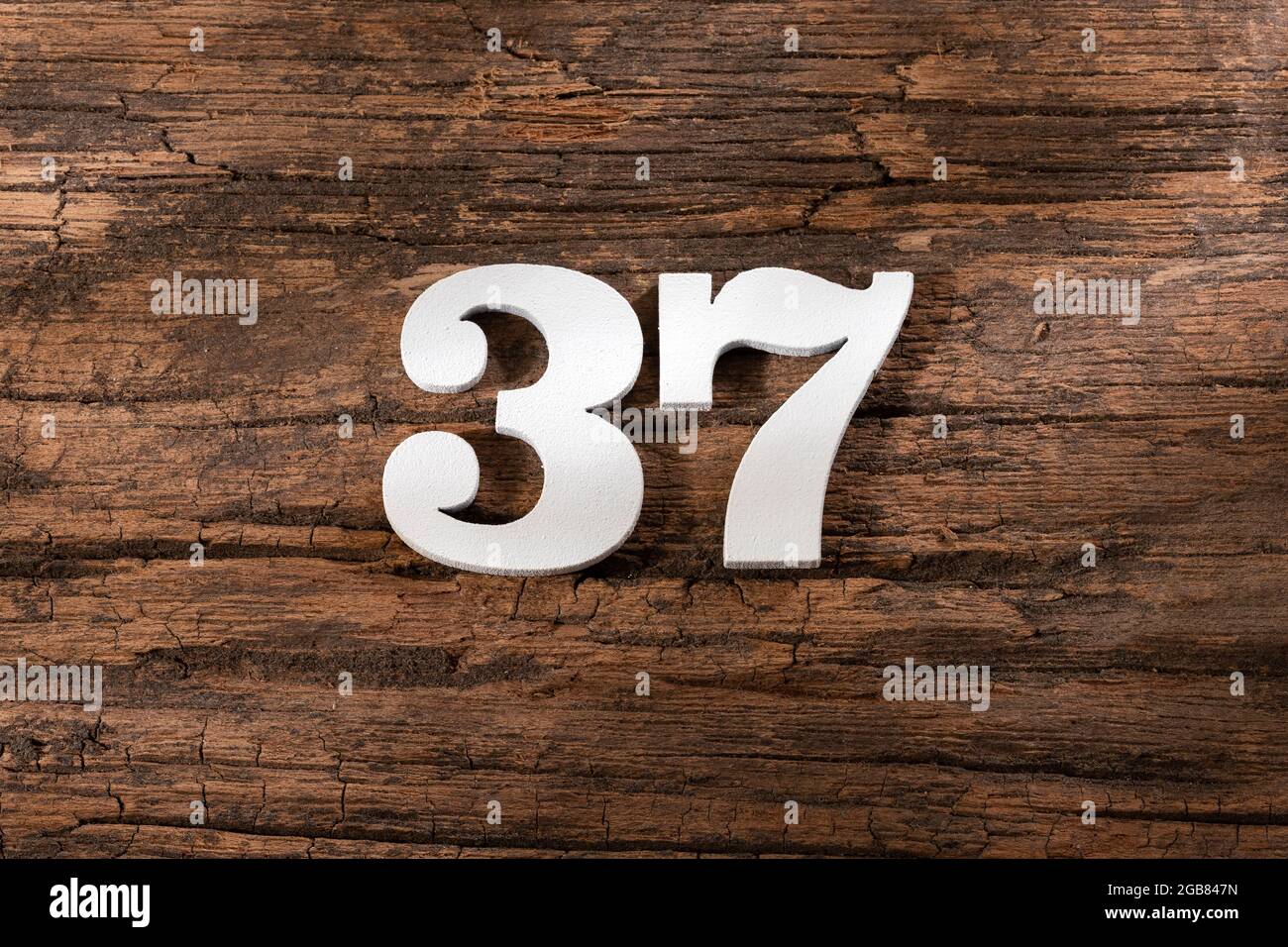 thirty seven 37 - White wooden number on rustic background Stock Photo ...