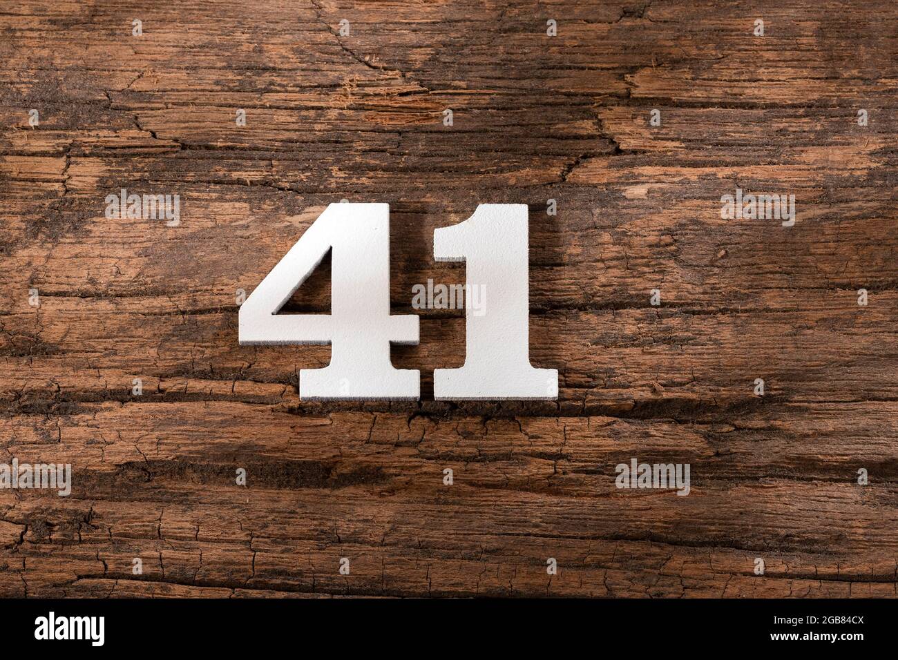 forty one 41 - White wooden number on rustic background Stock Photo - Alamy