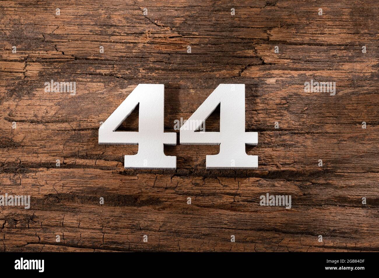 Number forty four 44 - White Piece on Rustic Wood Background Stock ...