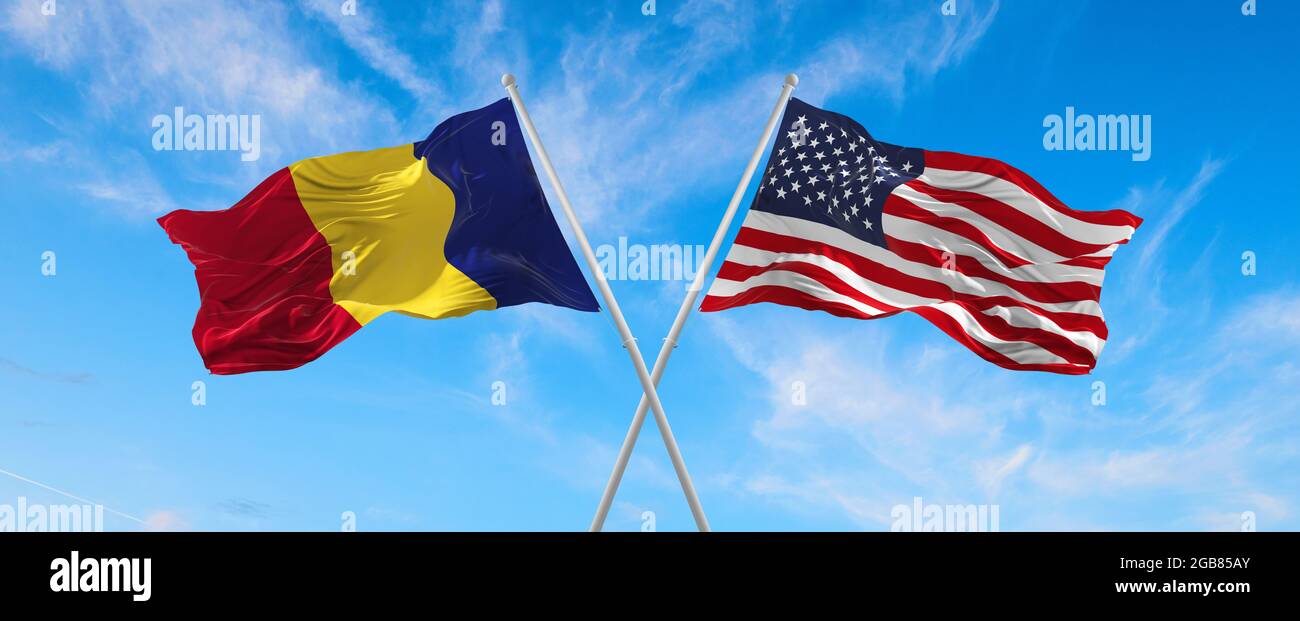 flags of USA and romania waving in the wind on flagpoles against the ...