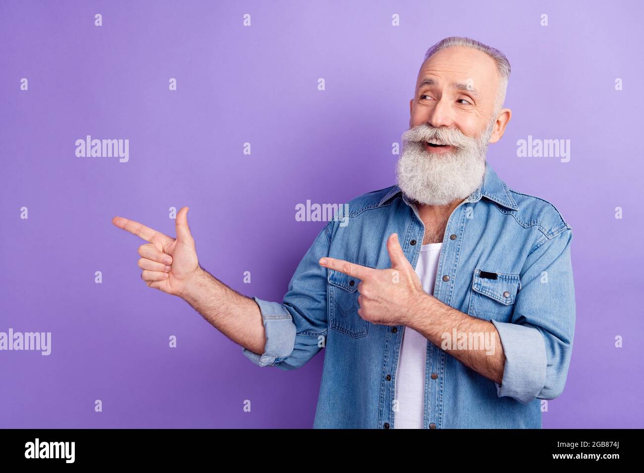 Photo of cute charming mature man dressed denim outfit looking pointing ...