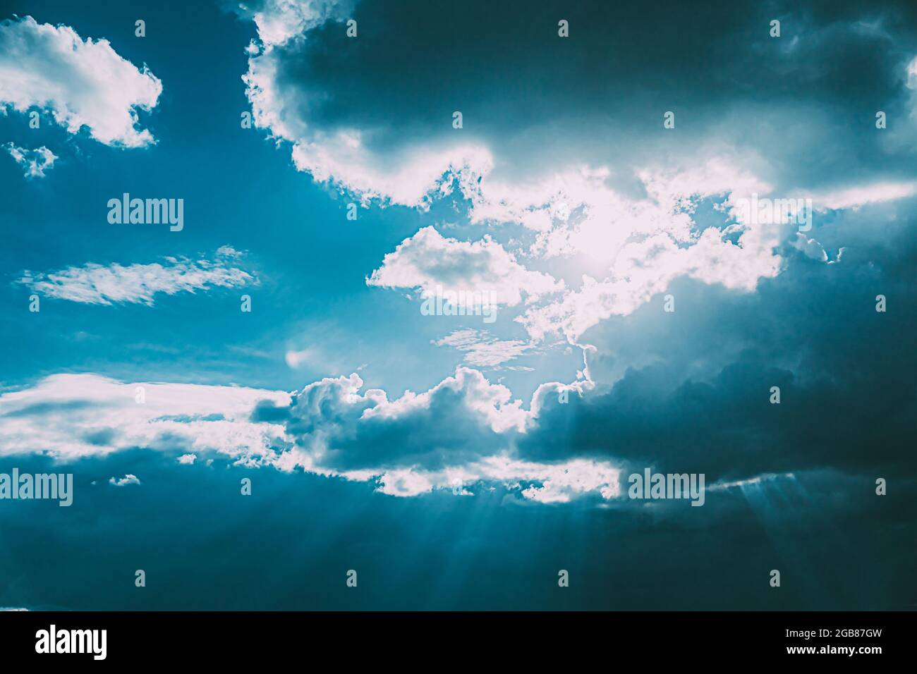 Sunrays Sunray Shine Through Dark Clouds In Cloudy Blue Sky. Natural ...