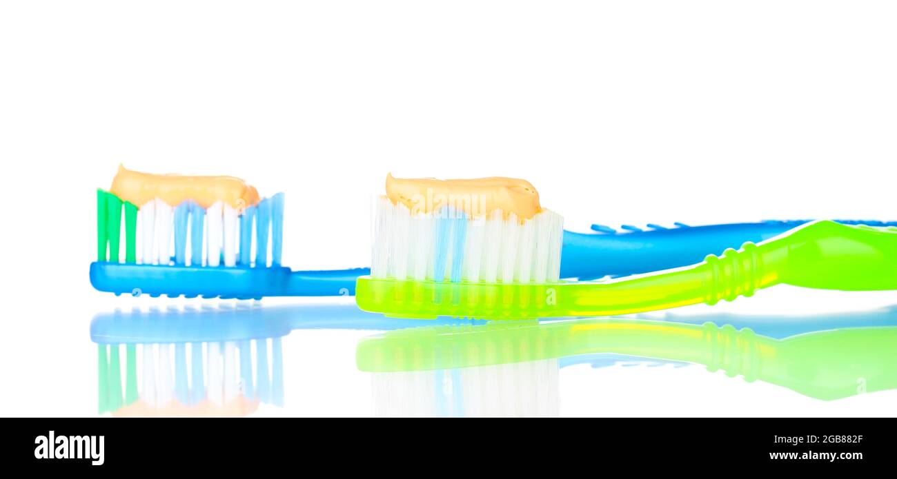 Toothbrushes with paste isolated on white Stock Photo - Alamy