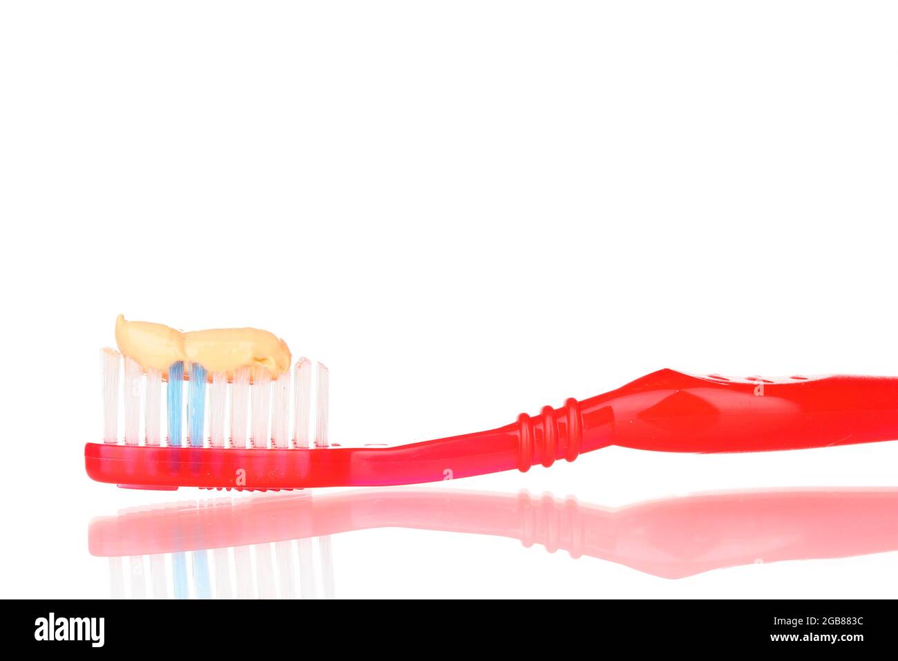 Toothbrush with paste isolated on white Stock Photo - Alamy