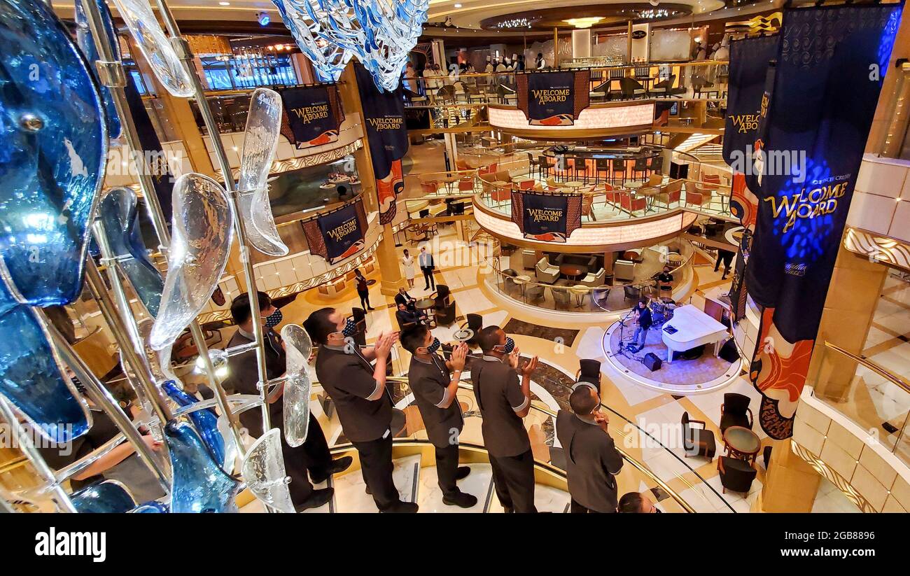 Crew of Majestic Princess claps as it welcomes people aboard ship Stock ...