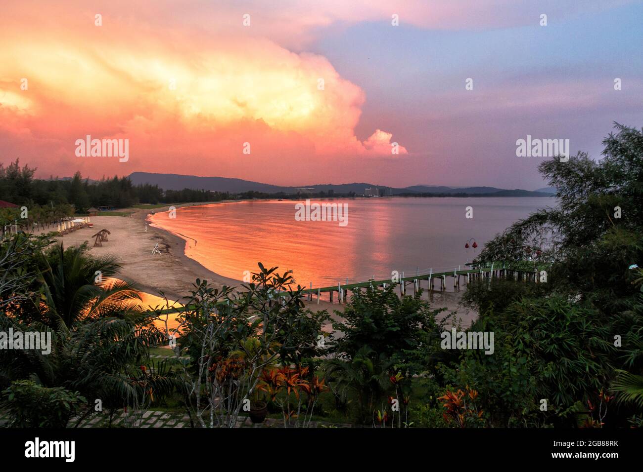 a sunset over a body of water Stock Photo - Alamy