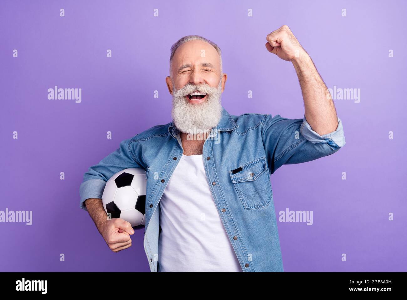 Photo of excited man happy positive smile hold soccer ball celebrate ...