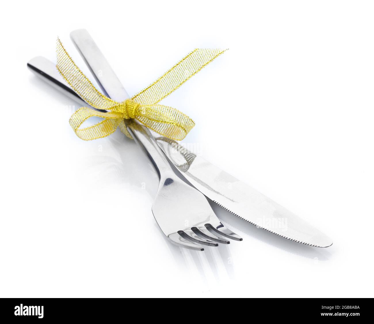 Silver fork and knife tied with ribbon isolated on white Stock Photo ...