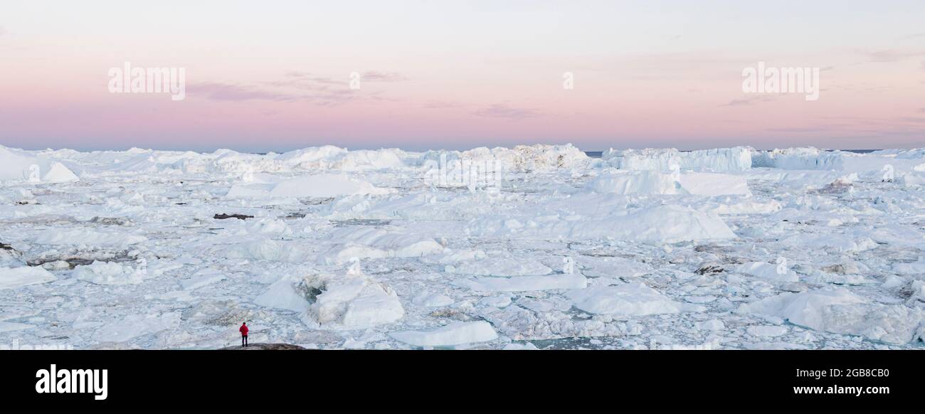 Travel in arctic landscape nature with icebergs. Greenland tourist man ...