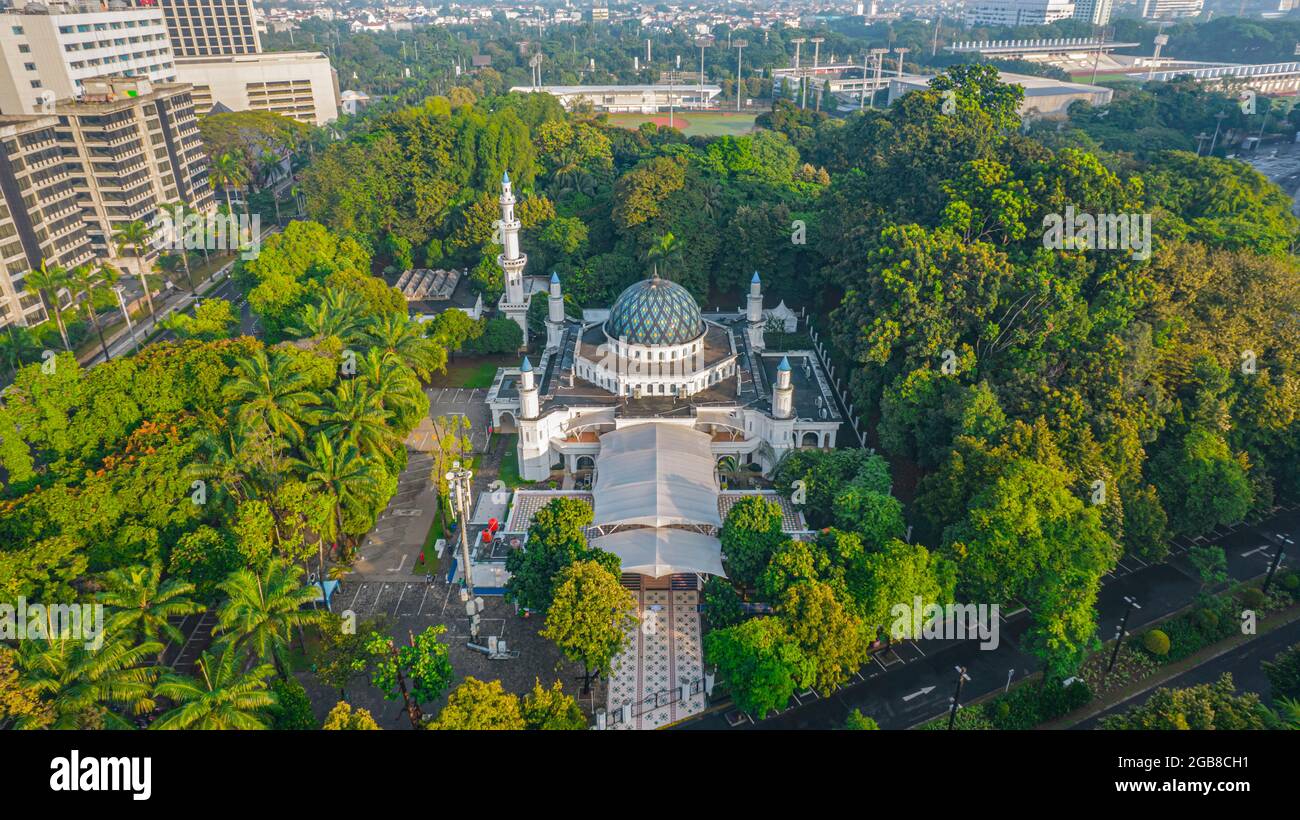 Aerial view of White mosque. Top view of the mosque forest. Jakarta ...