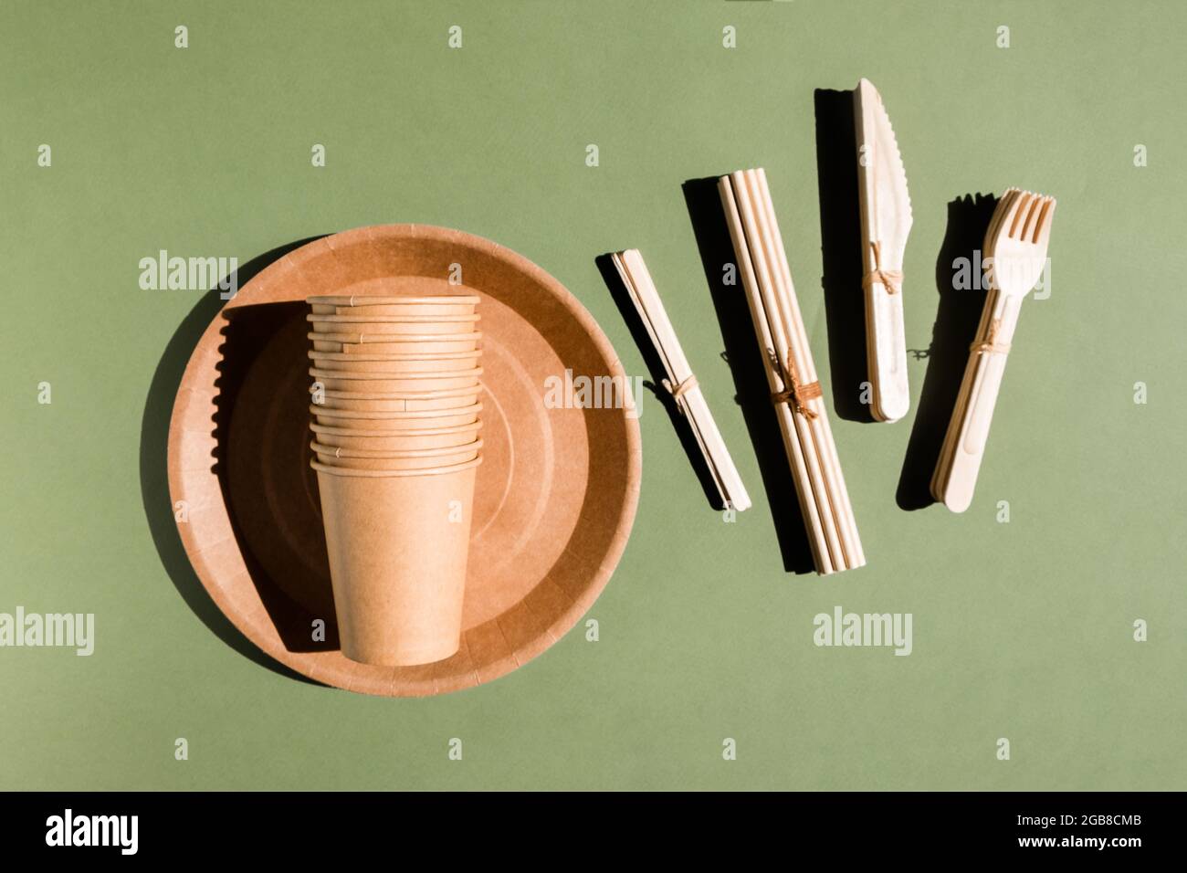 Set of Eco friendly tableware for home and picnic on green background ...