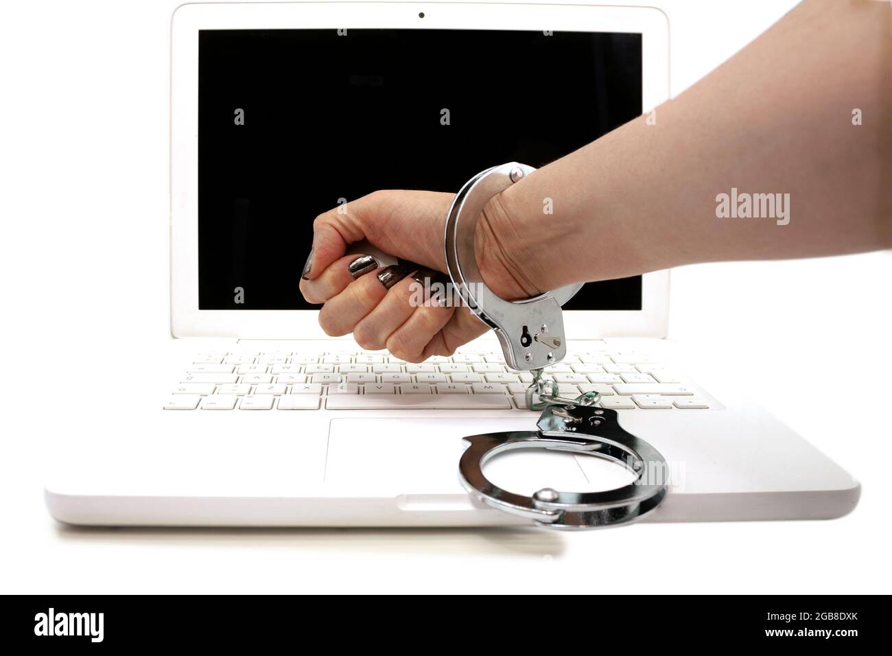 conceptual cybercrime thief with handcuffed hand in front of white ...