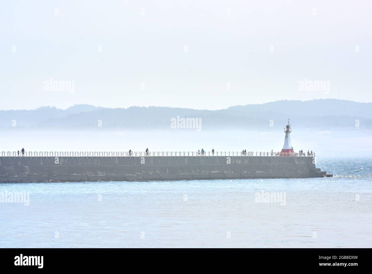 Ogden Point Breakwater Victoria. A misty day as people visit the Ogden ...