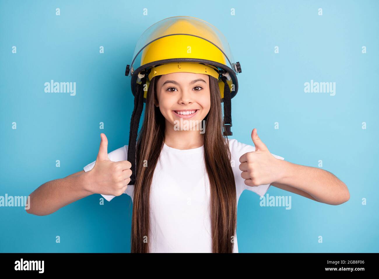 Photo of young girl happy positive smile wear helmet show thumb-up like ...