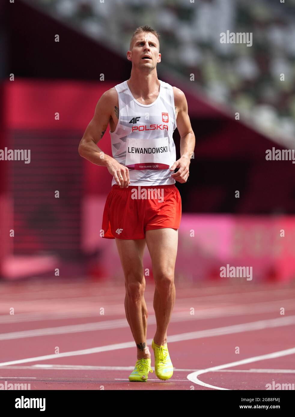 Poland's Marcin Lewandowski crossing the line following a fall during ...
