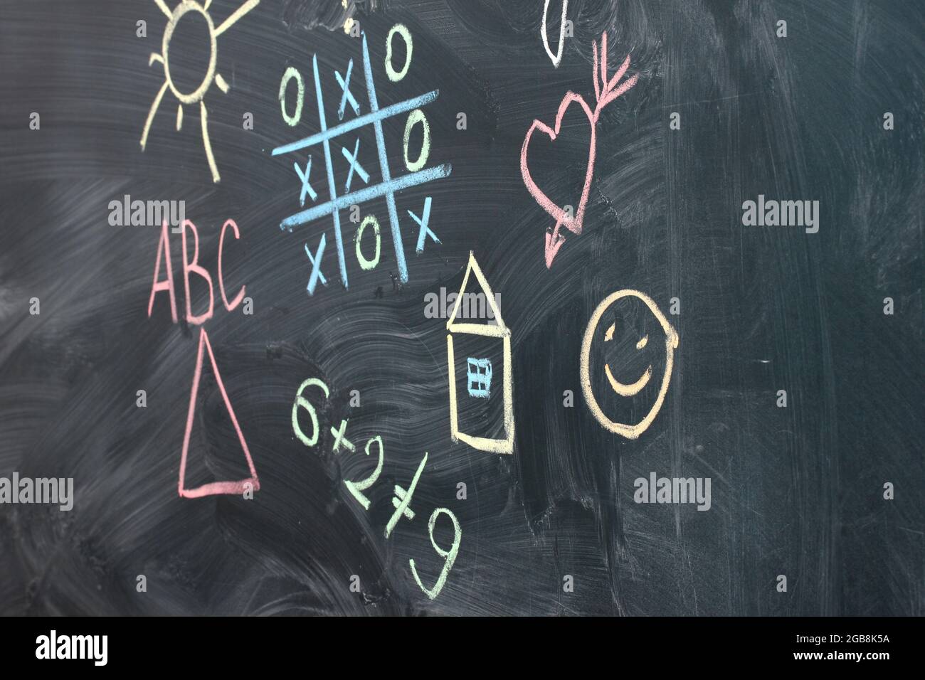 The drawings and inscriptions in colorful chalk on the blackboard Stock ...