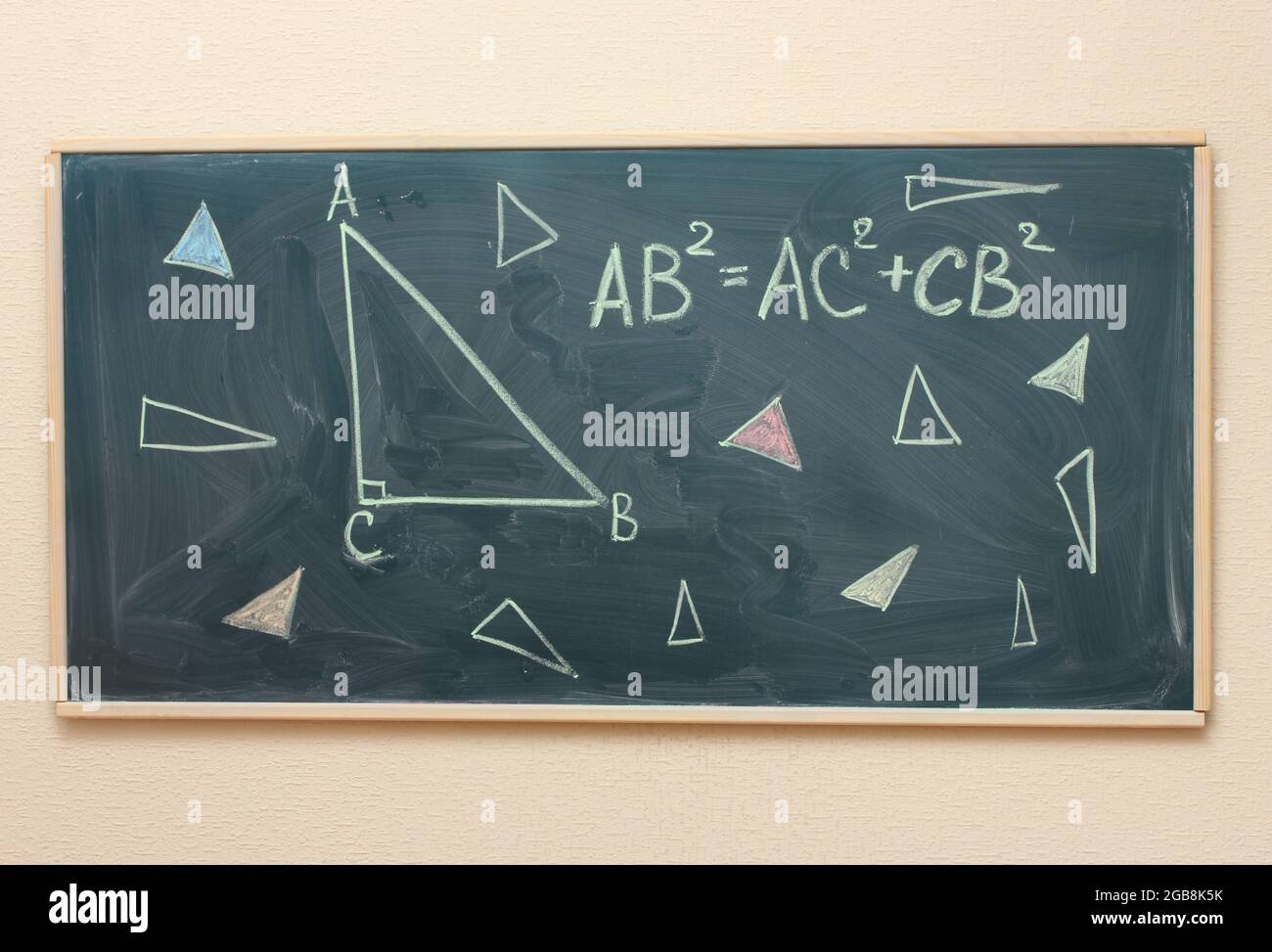 Math formulas written on the desk Stock Photo - Alamy