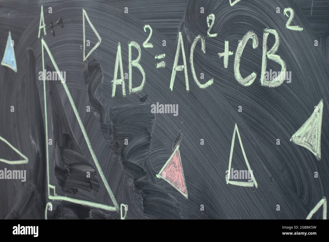 Math formulas written on the desk Stock Photo - Alamy