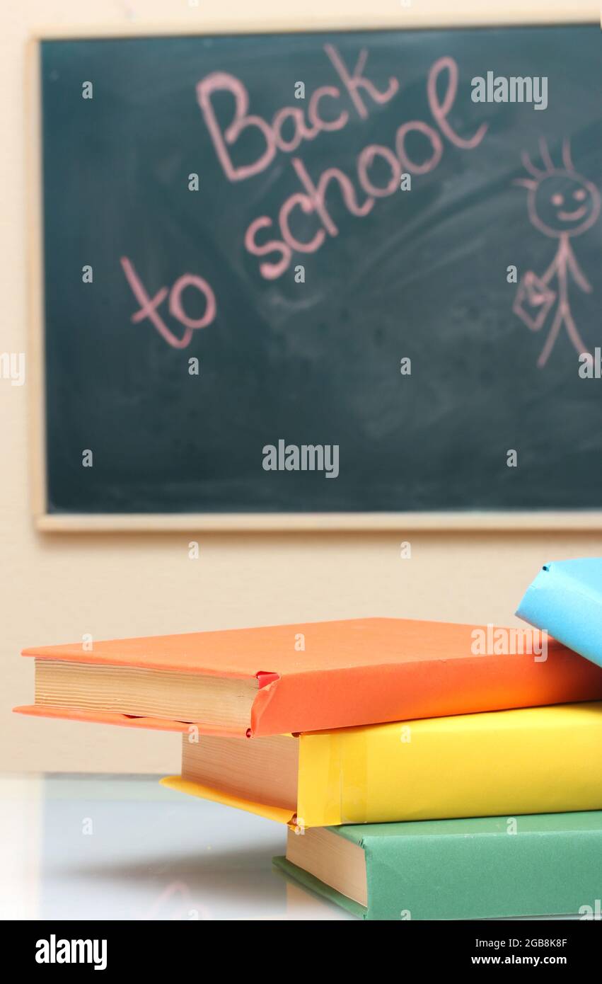 School books and the desk. Back to school Stock Photo - Alamy