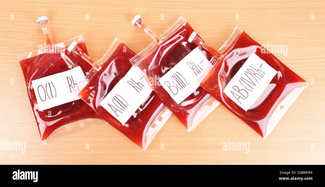 Bags of blood on wooden background Stock Photo - Alamy