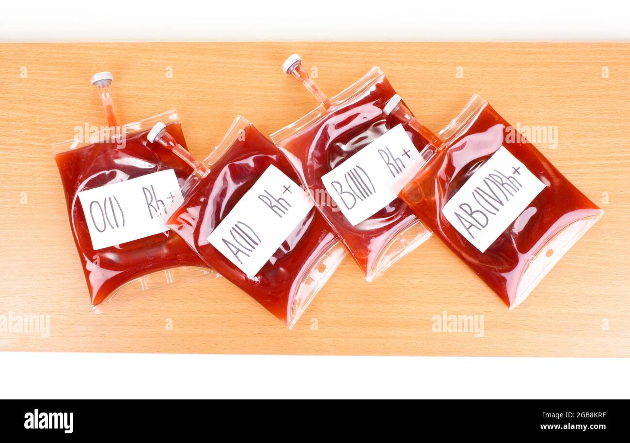 Bags of blood on wooden background Stock Photo - Alamy