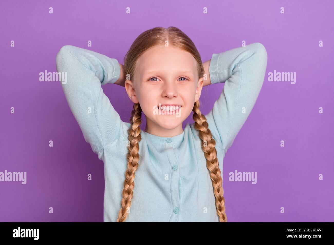 Photo of relaxed joyful small girl hands head enjoy rest white smile ...