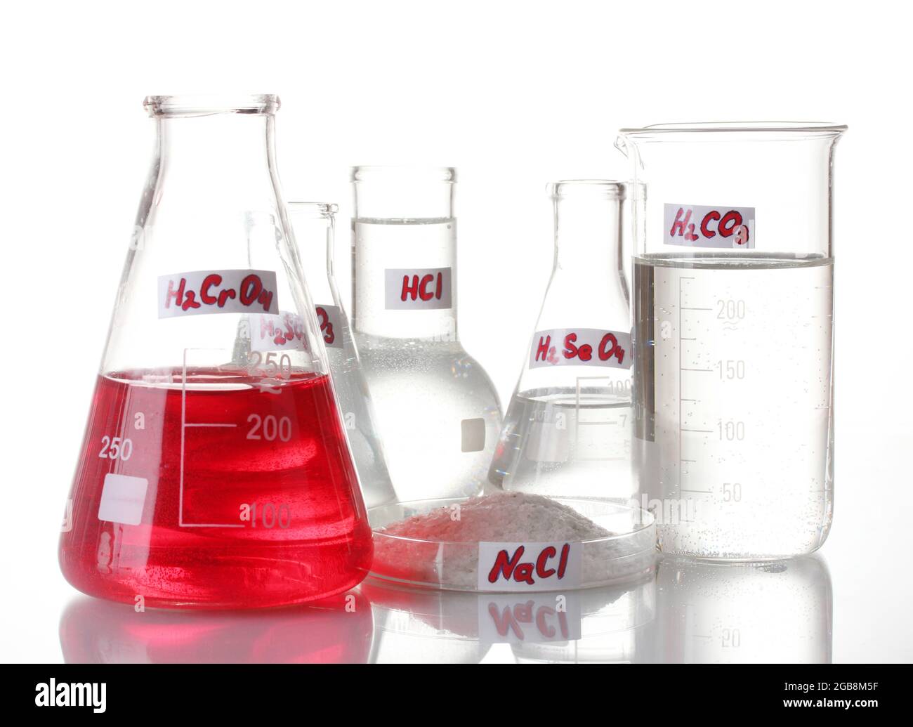 Test-tubes with various acids and chemicals isolated on white Stock ...