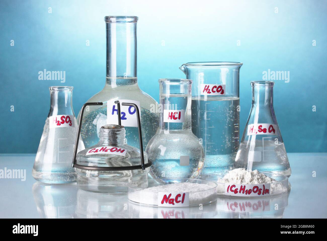 Test-tubes with various acids and chemicals on bright background Stock ...