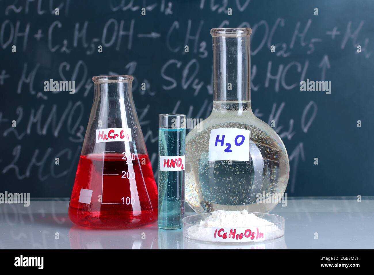 Test-tubes with various acids and other chemicals on the background of ...