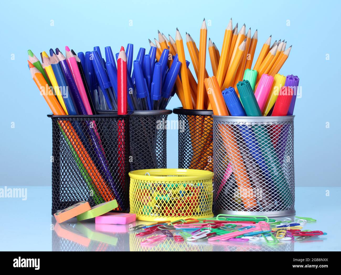 Color holders for office supplies with them on bright background Stock ...