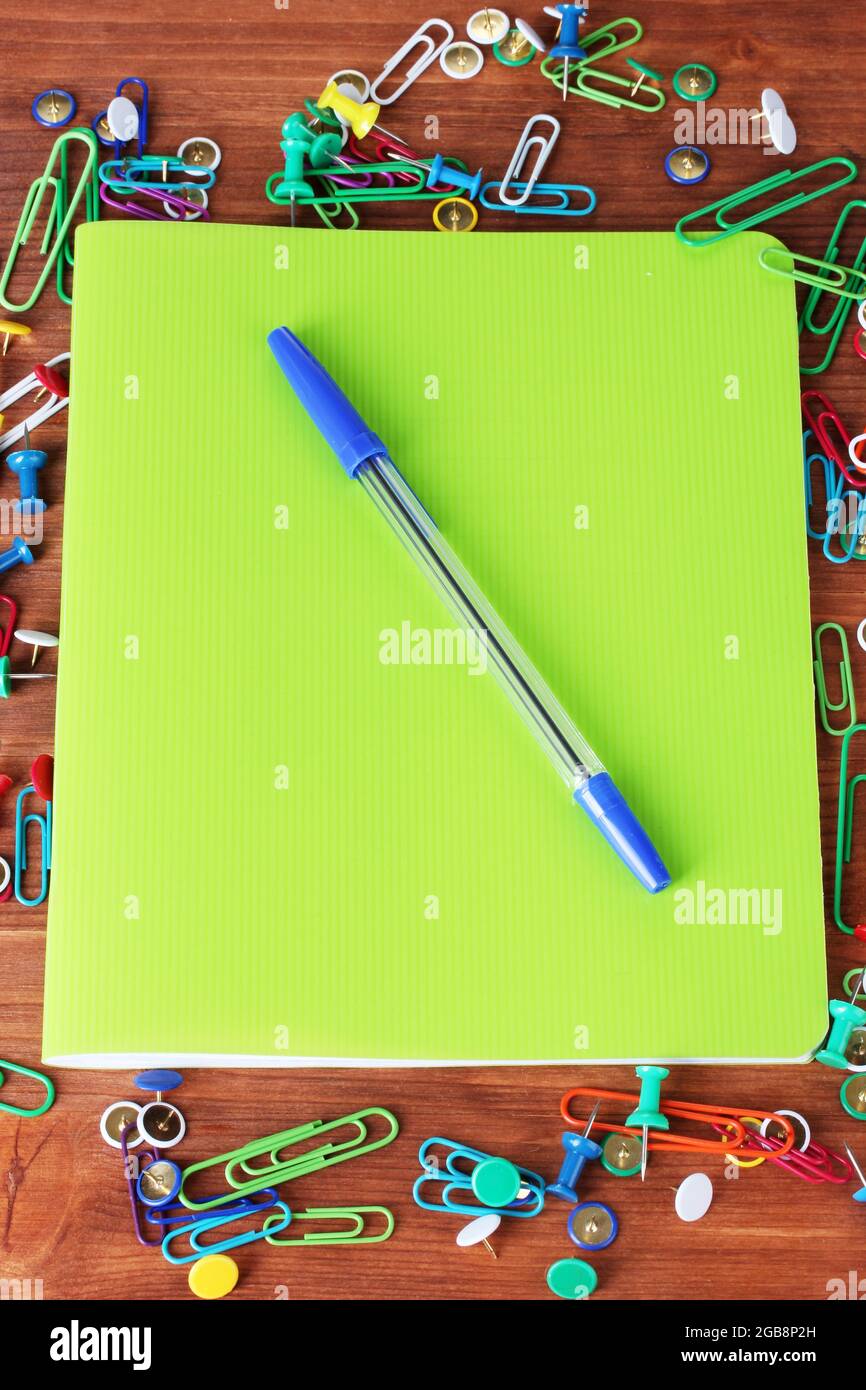 Noteook in the design of stationery on wooden background Stock Photo ...